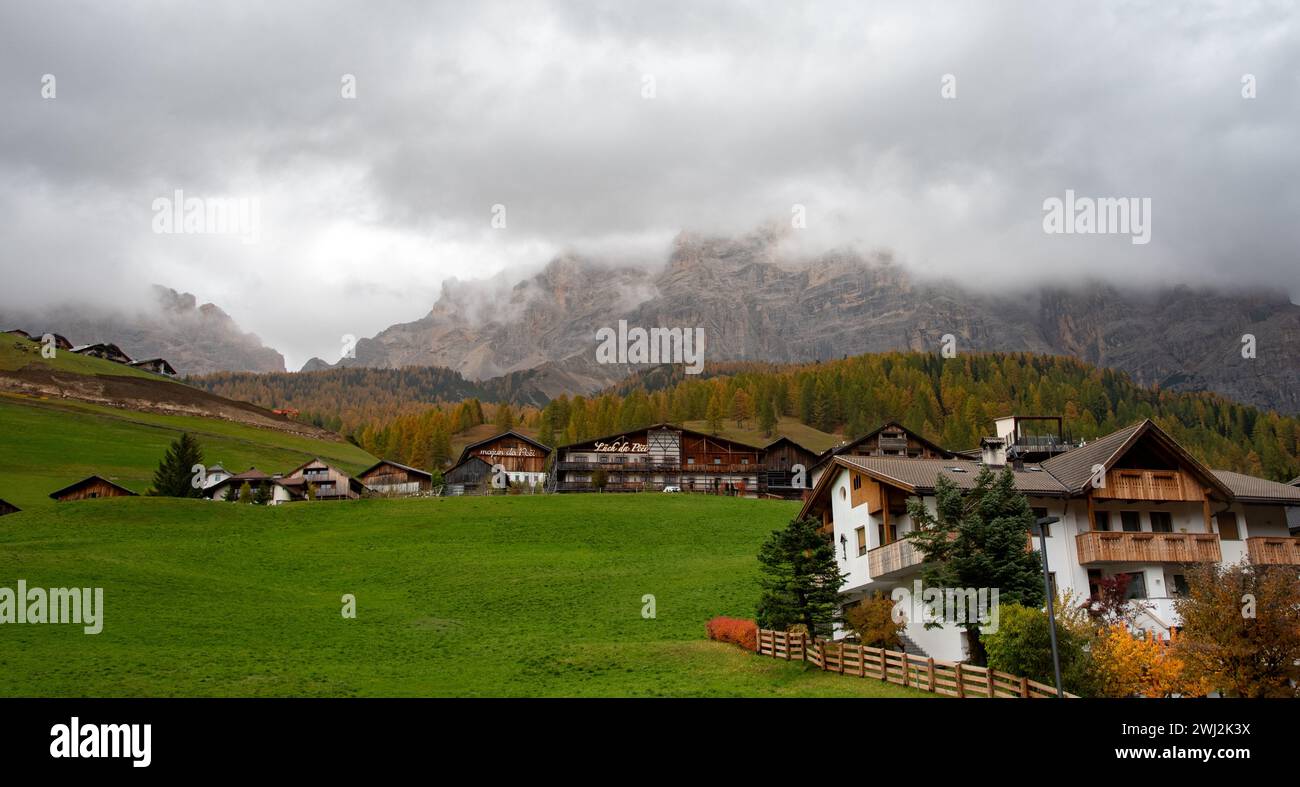 Traditional wooden cottage mountain houses in the green field in the ...
