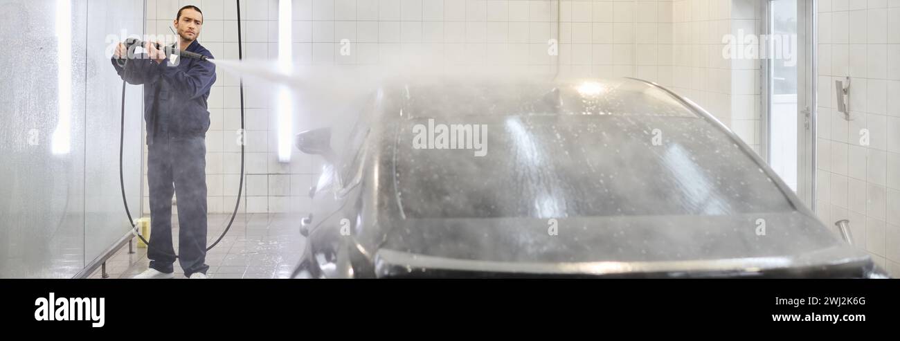 handsome devoted serviceman in uniform with collected hair using hose ...