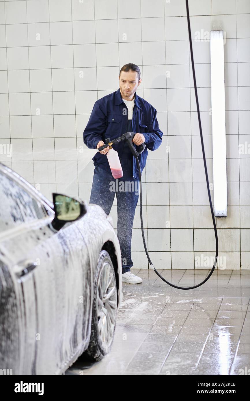 good looking professional worker in uniform with collected hair washing ...
