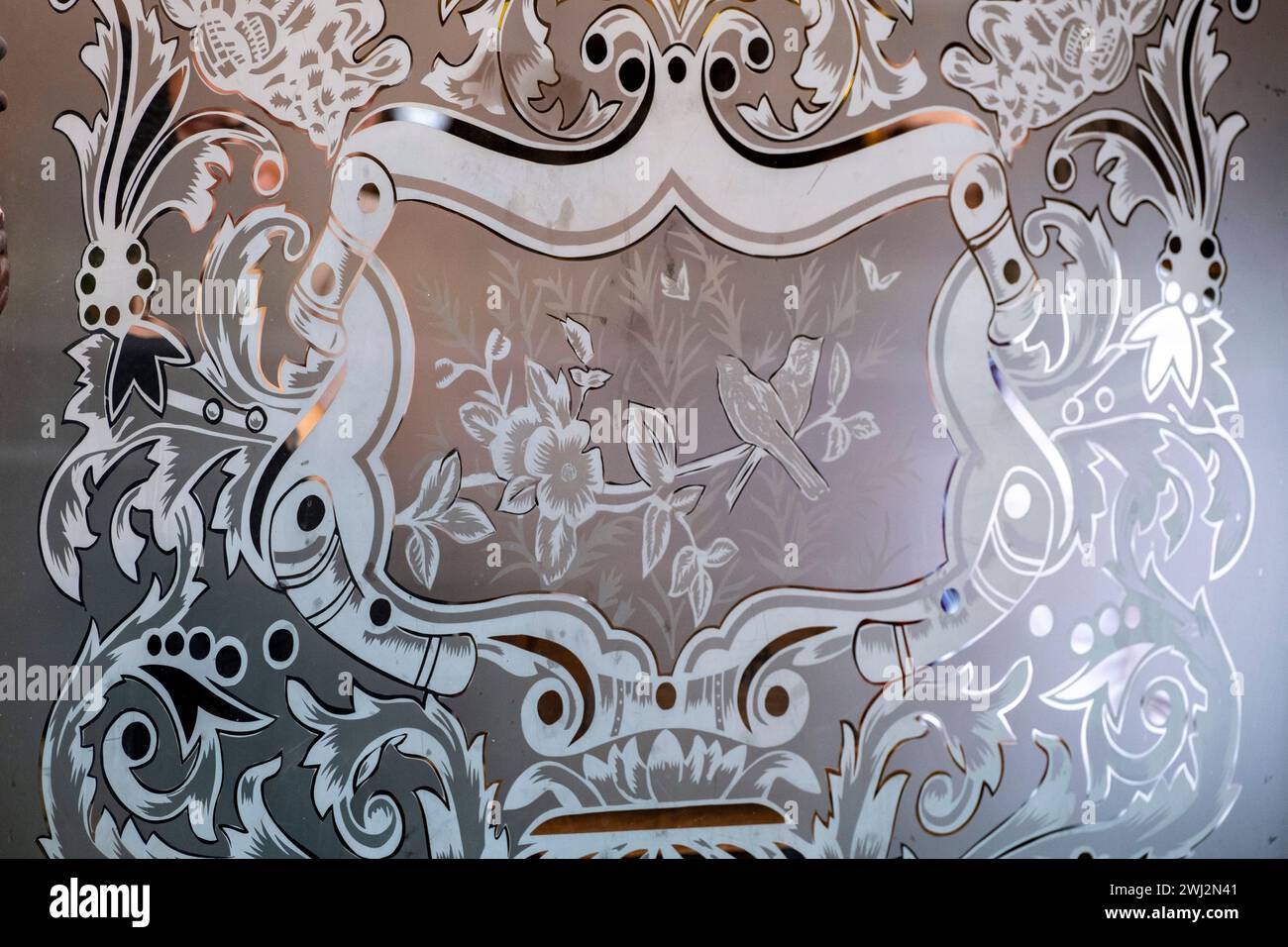 Elaborate etched glass on the window of a traditional English pub on ...