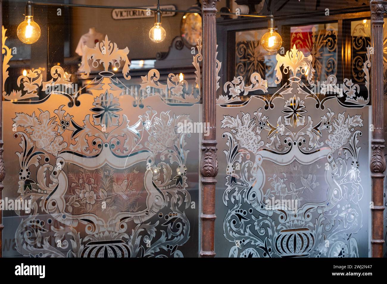 Elaborate etched glass on the window of a traditional English pub on ...