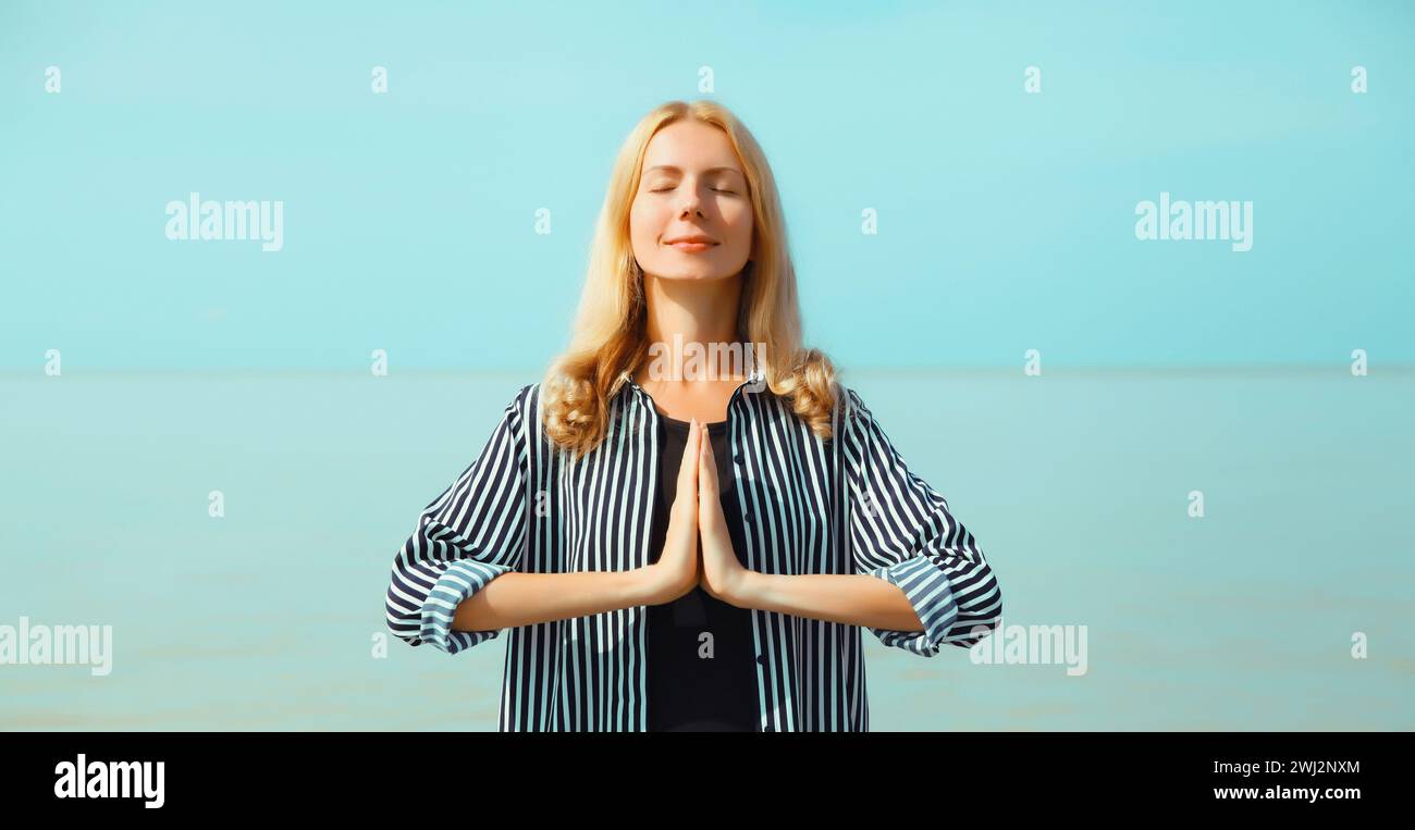 Calm relaxing healthy young woman meditates, practicing yoga enjoying ...