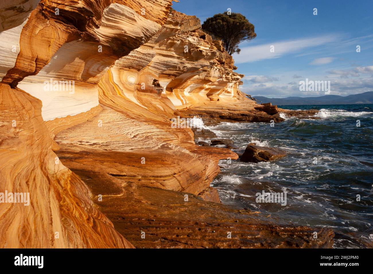 Painted cliffs on Maria island on the east coast of Tasmania in ...