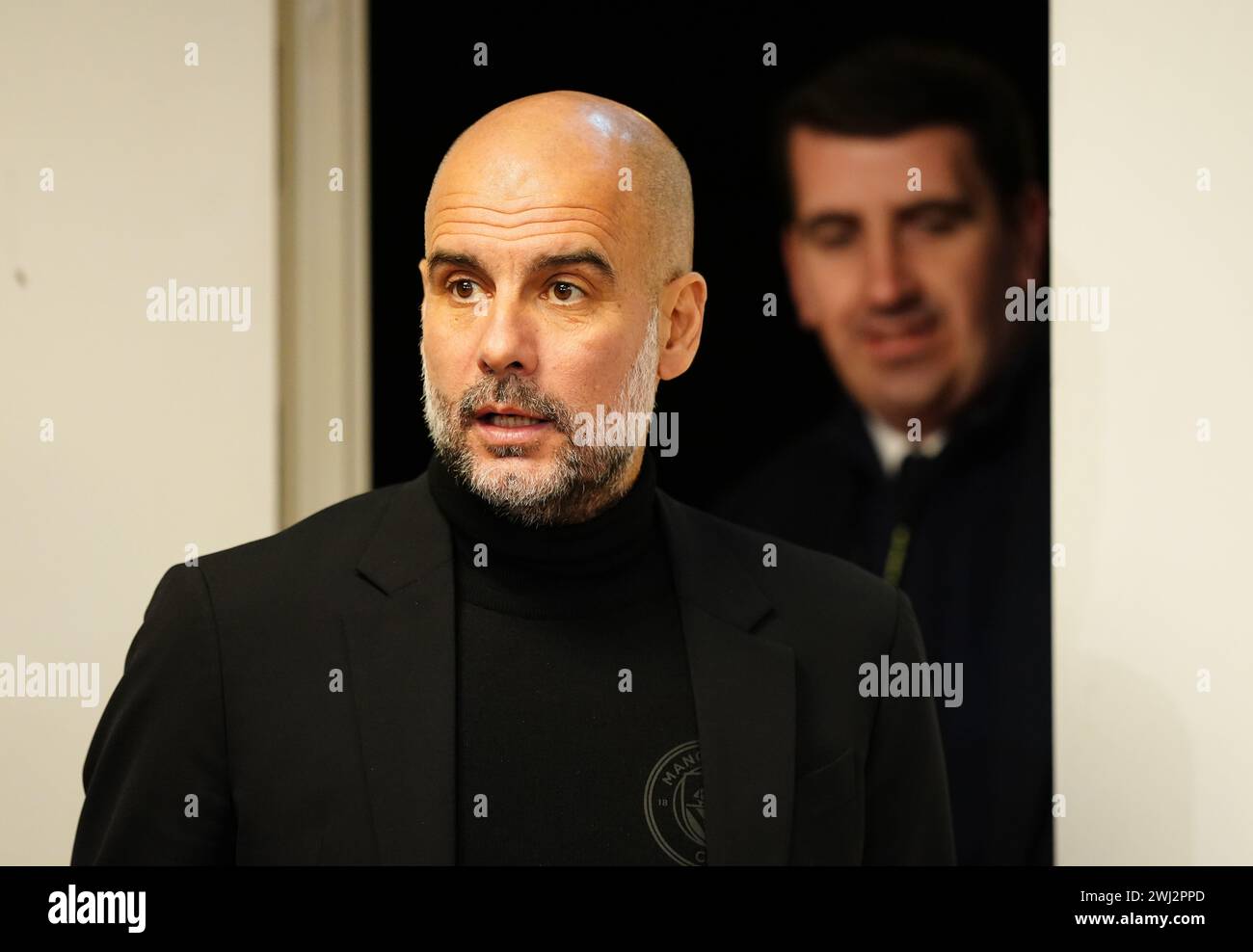 Manchester City manager Pep Guardiola arrives for a press conference at ...