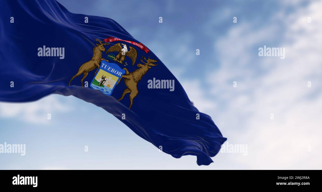Michigan state flag waving in the wind on a clear day Stock Photo - Alamy