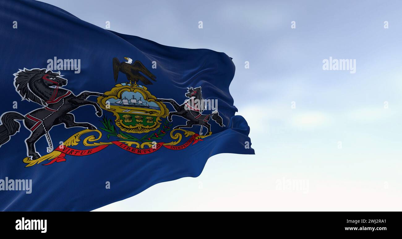 Close-up of Pennsylvania state flag waving. Blue field with state coat ...