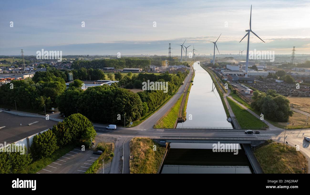 Sustainable Pathways: Aerial View of a Canal and Wind Turbines Stock ...