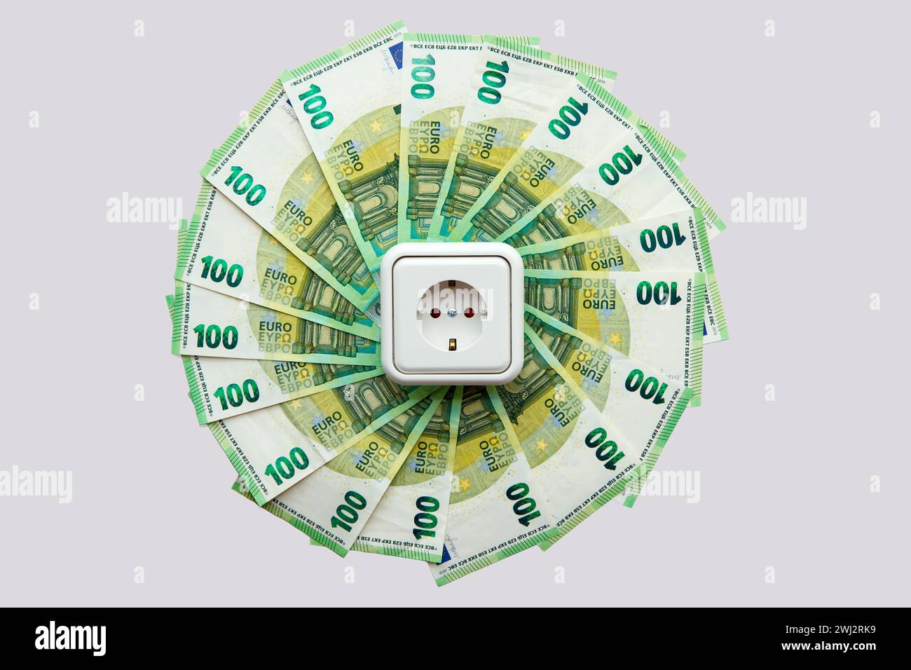 Electric socket and euro money currency in circle. Concept of saving ...