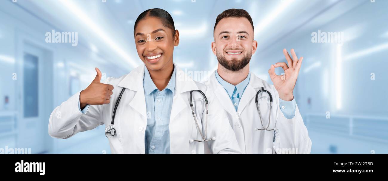 Two cheerful medical professionals in white lab coats are giving a ...