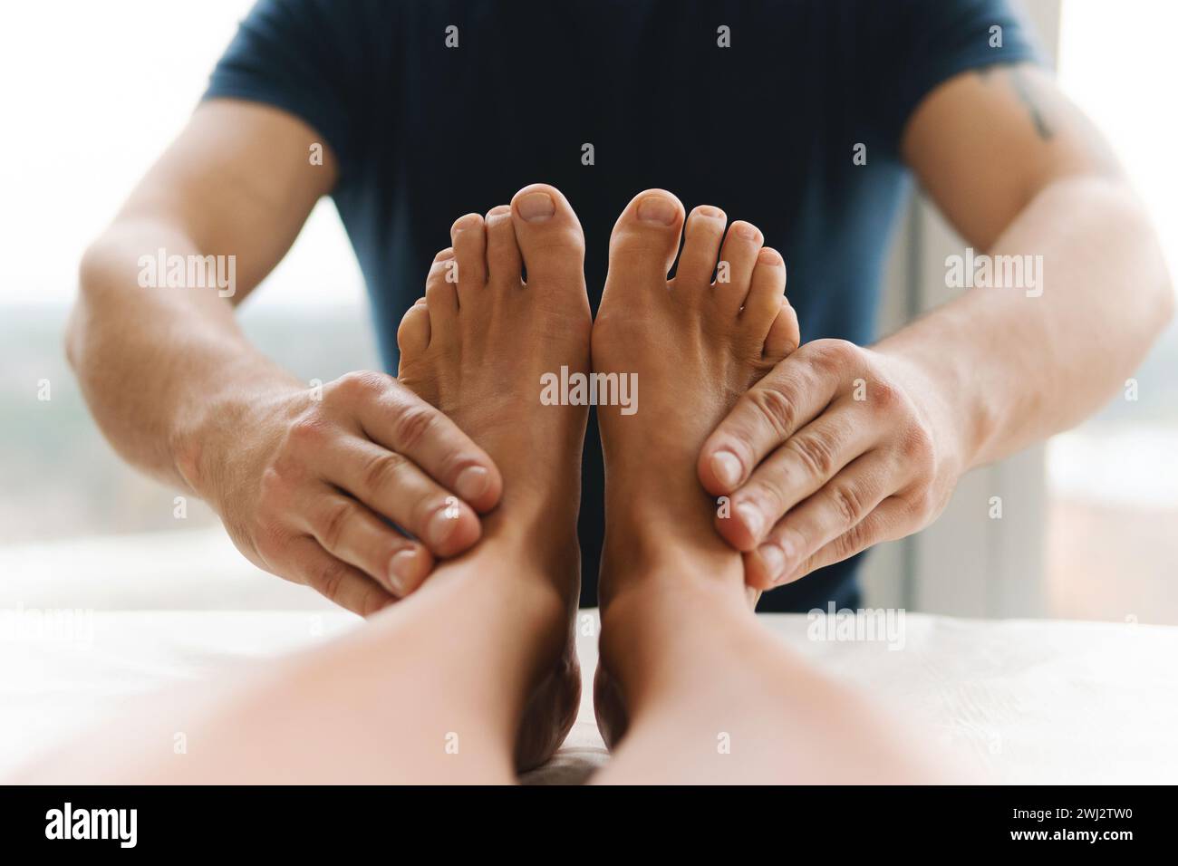 Female foot reflexology hi-res stock photography and images - Alamy