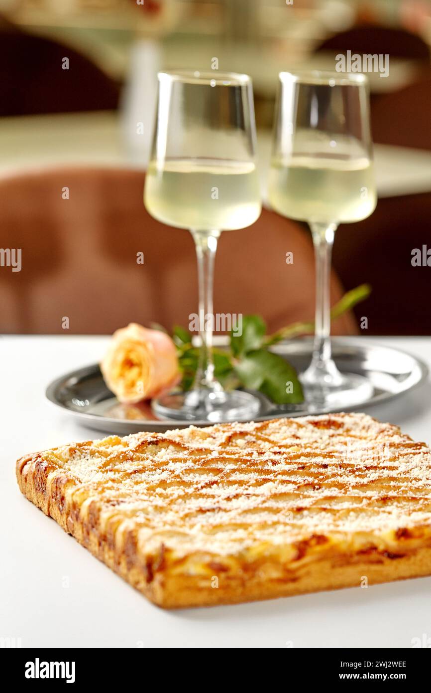 Golden lattice cheese galette with romantic dining setting Stock Photo ...