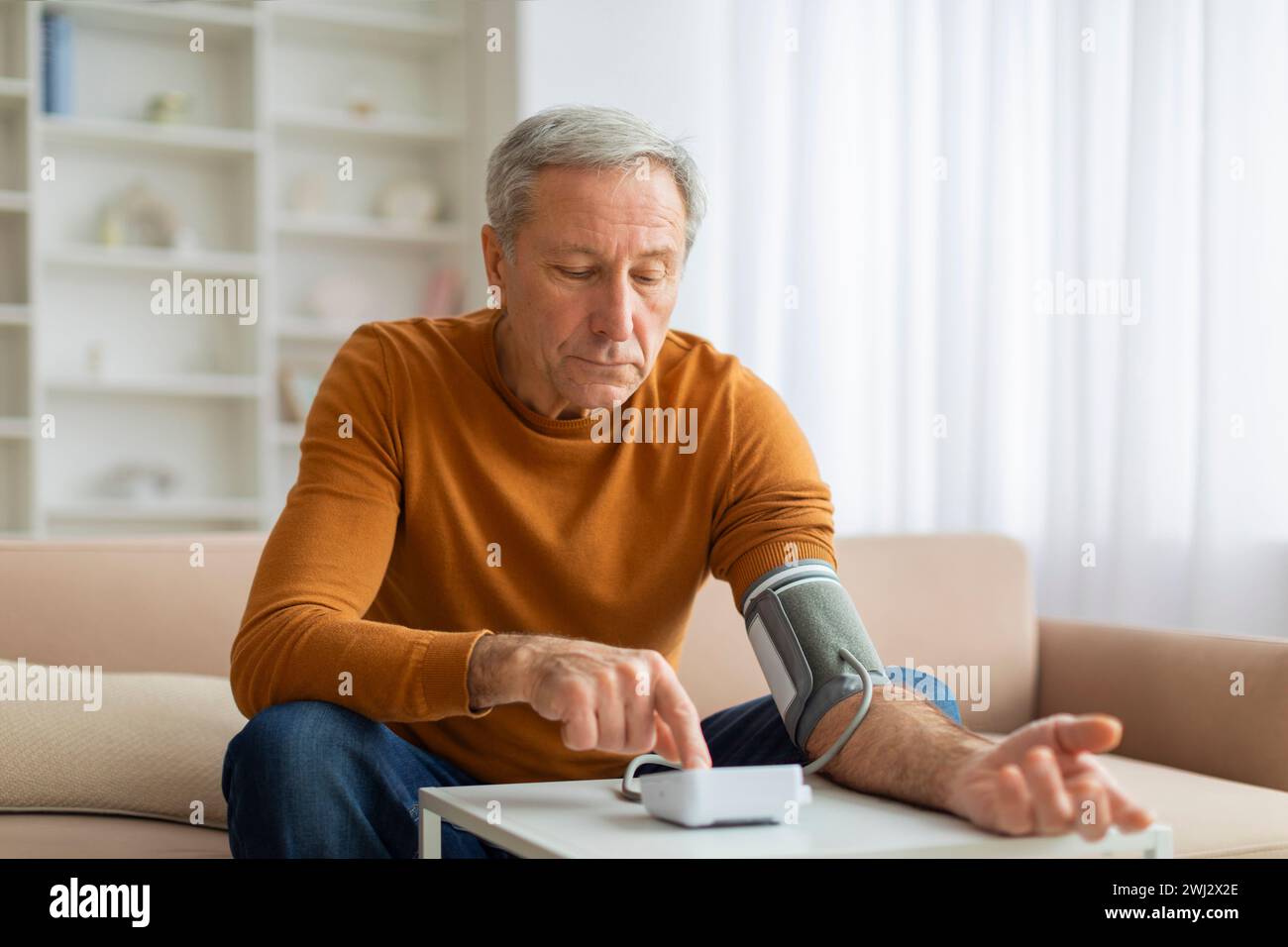 elderly man doing morning checkup after waking up Stock Photo - Alamy