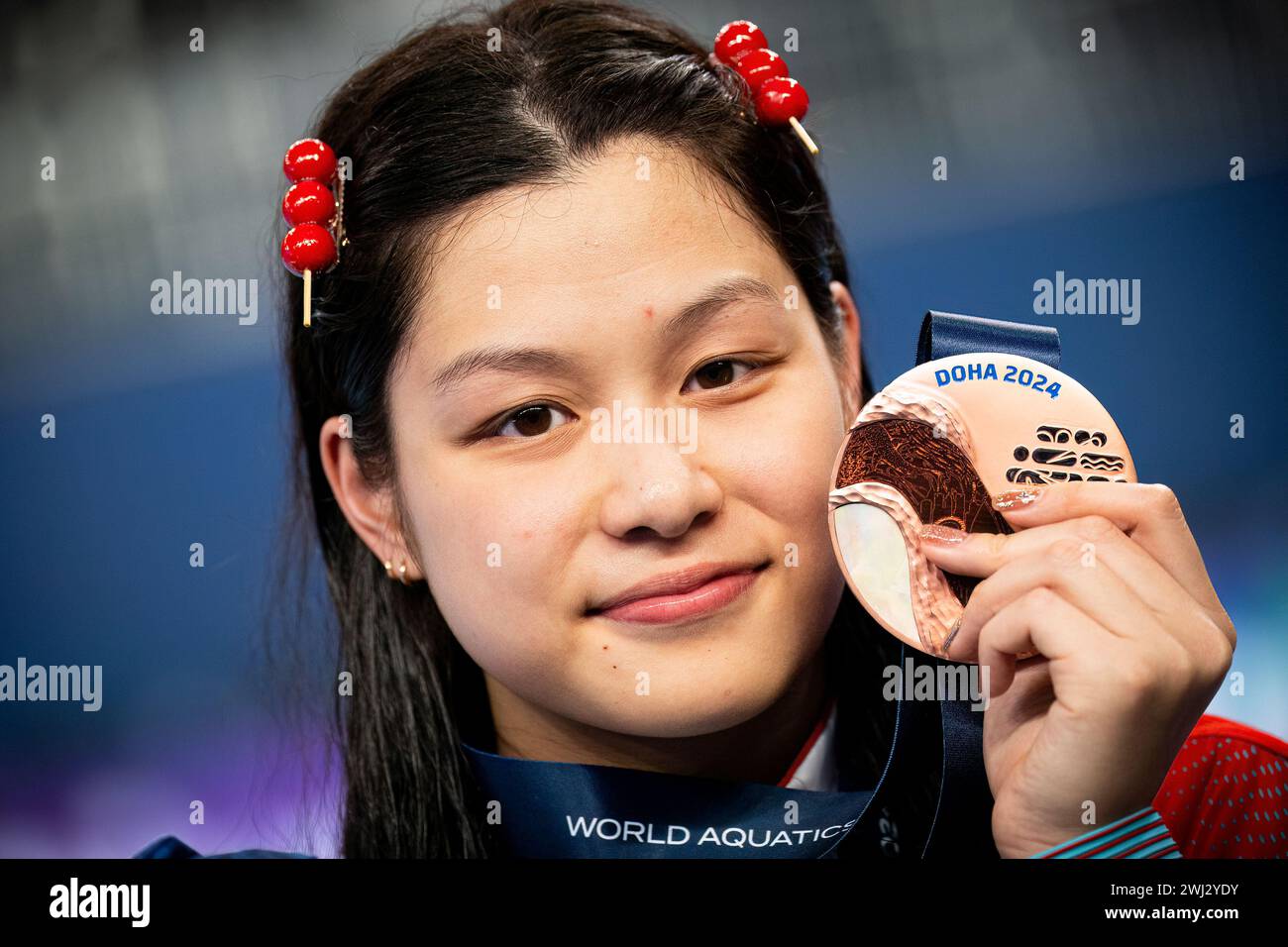 Yiting Yu of China shows the bronze medal after competing in the ...