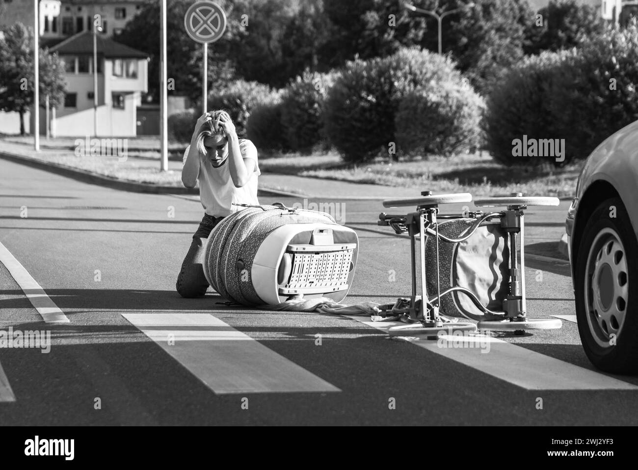 Shocked mother on the crosswalk after a car accident when a vehicle ...