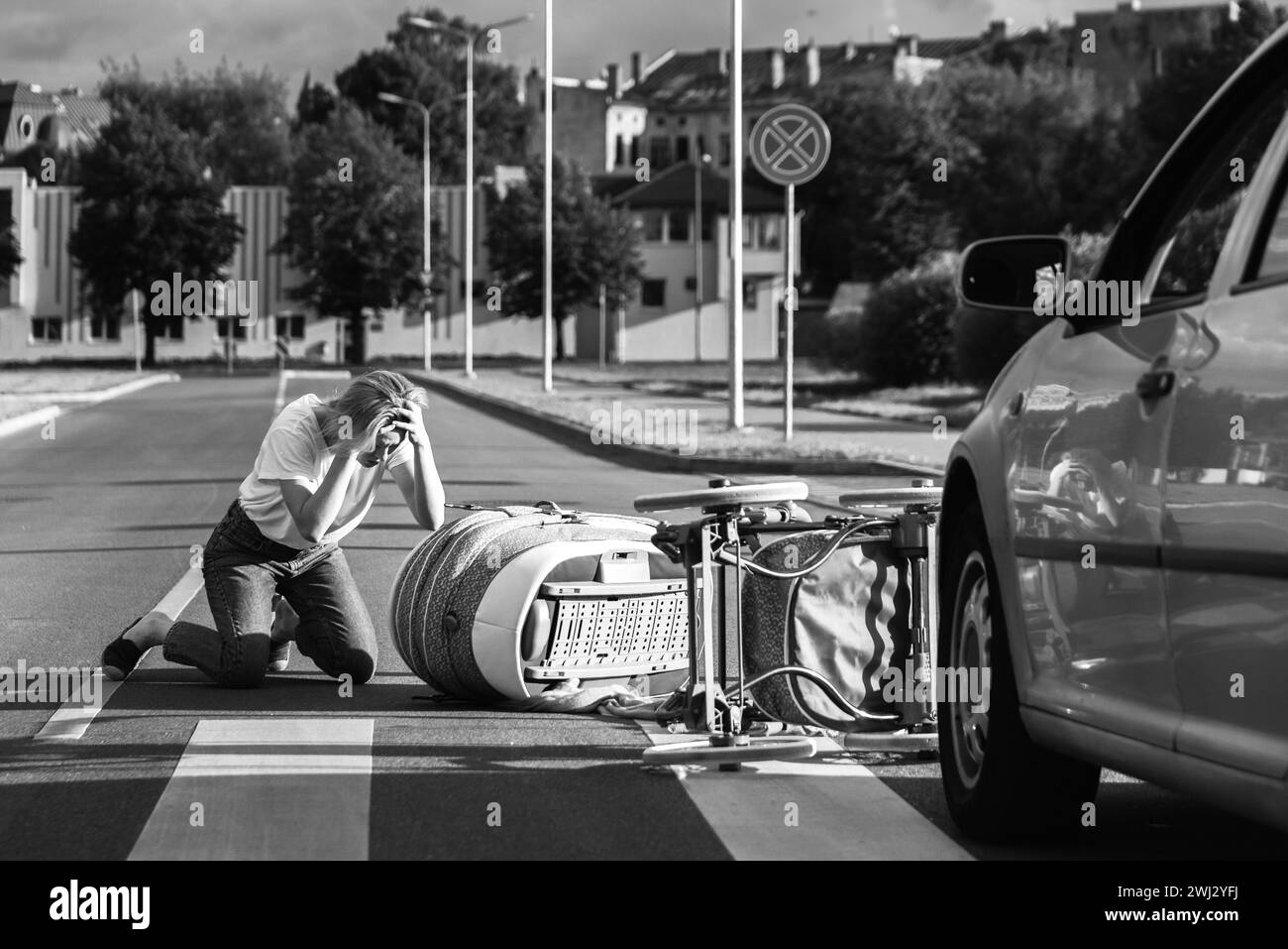 Shocked mother on the crosswalk after a car accident when a vehicle ...