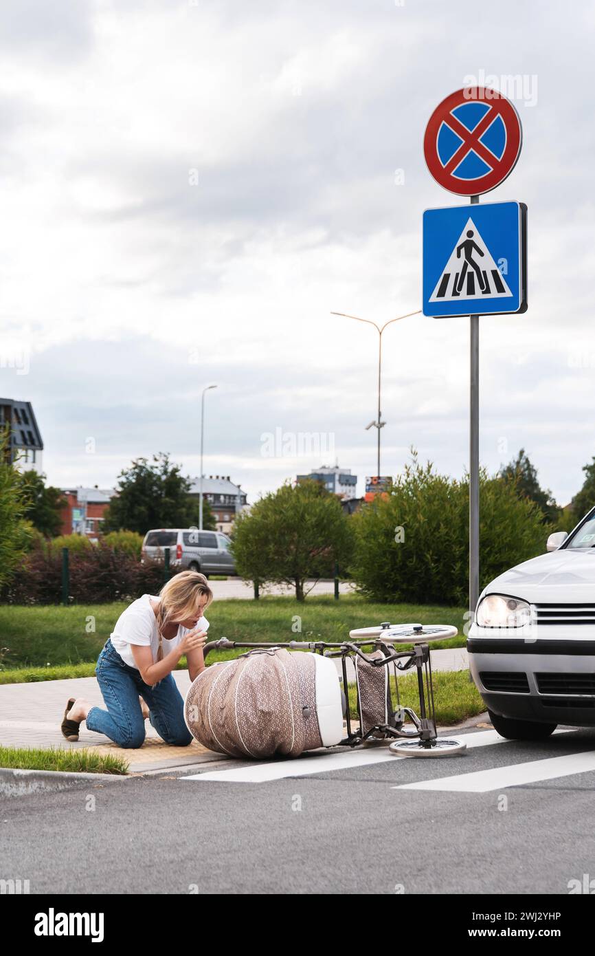 Shocked mother on the crosswalk after a car accident when a vehicle ...