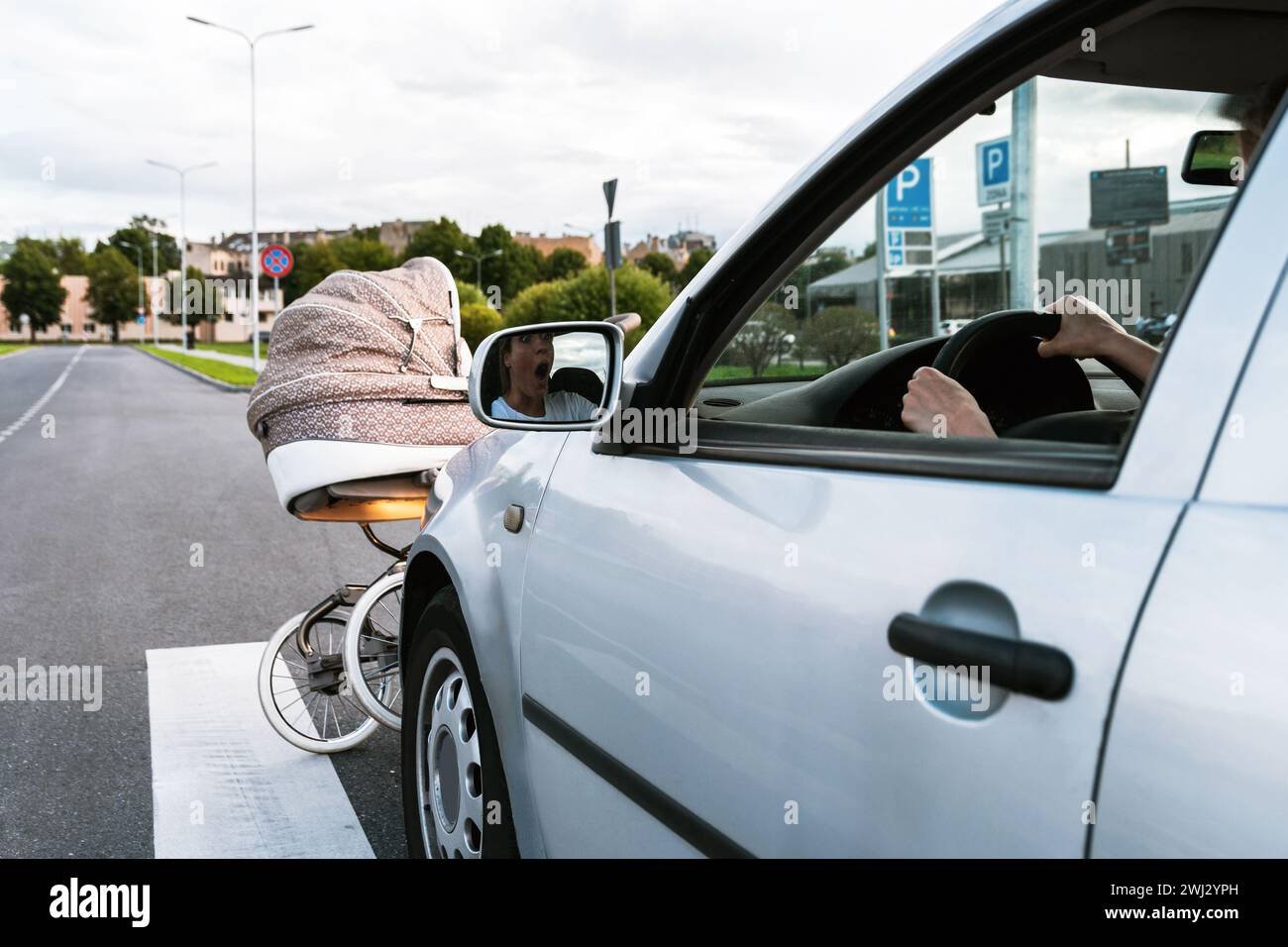 Car accident on the crosswalk. Vehicle hits the baby pram at high speed ...