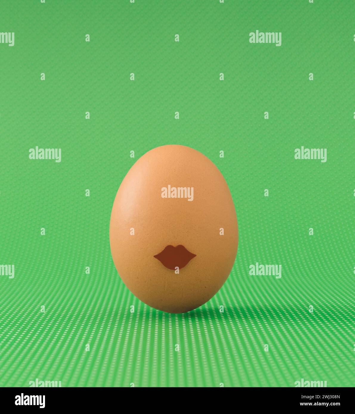 Easter egg with red lips on green background. Minimal Easter concept ...