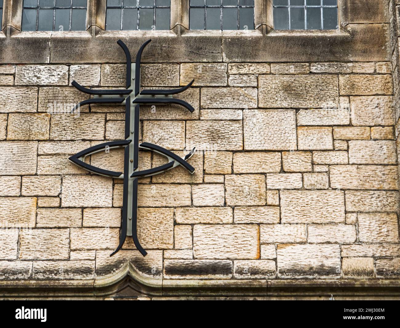 Cross and fish symbols combined on a church exterior wall in Hexham ...