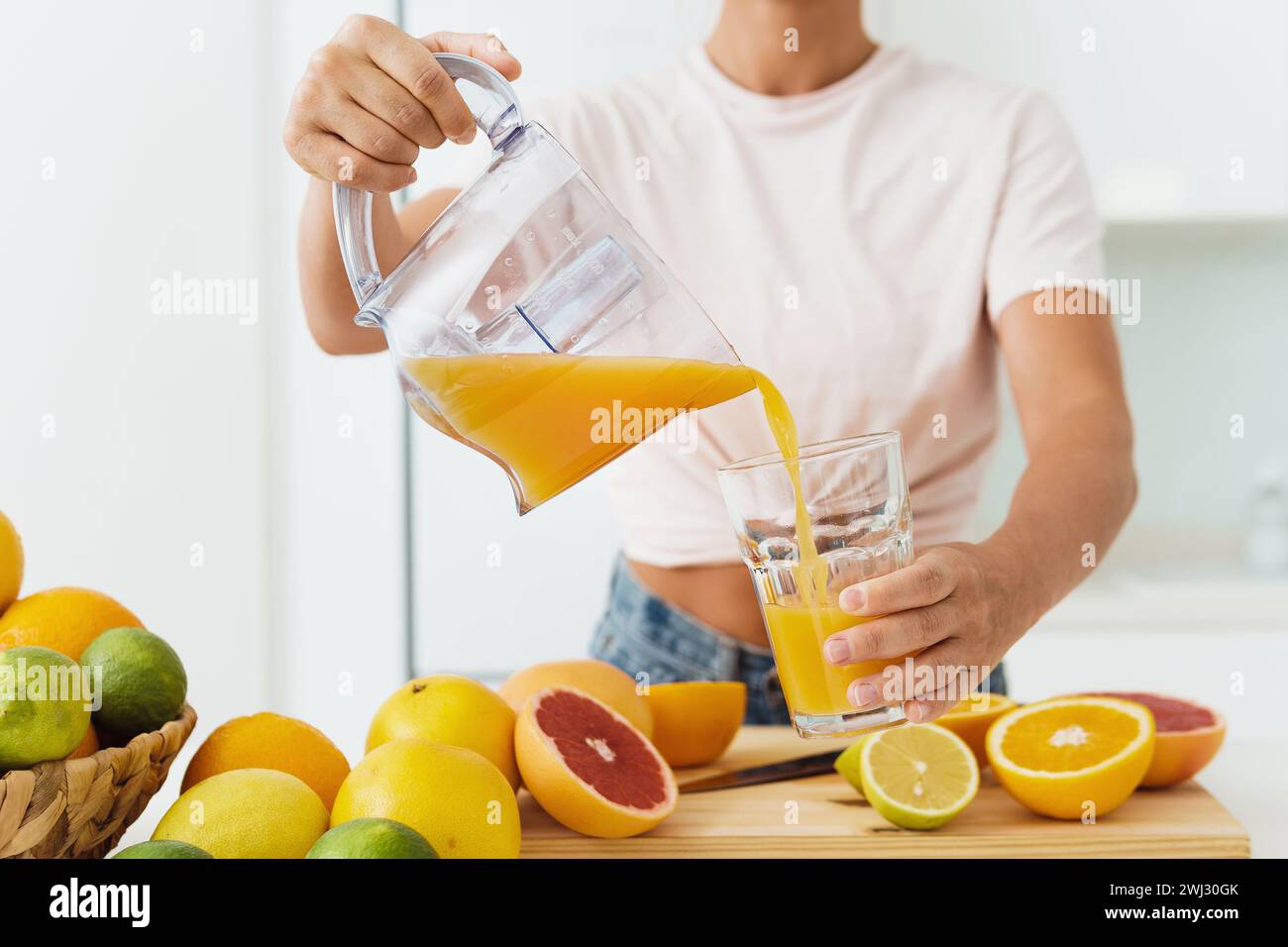 Woman pouring juice hi-res stock photography and images - Alamy