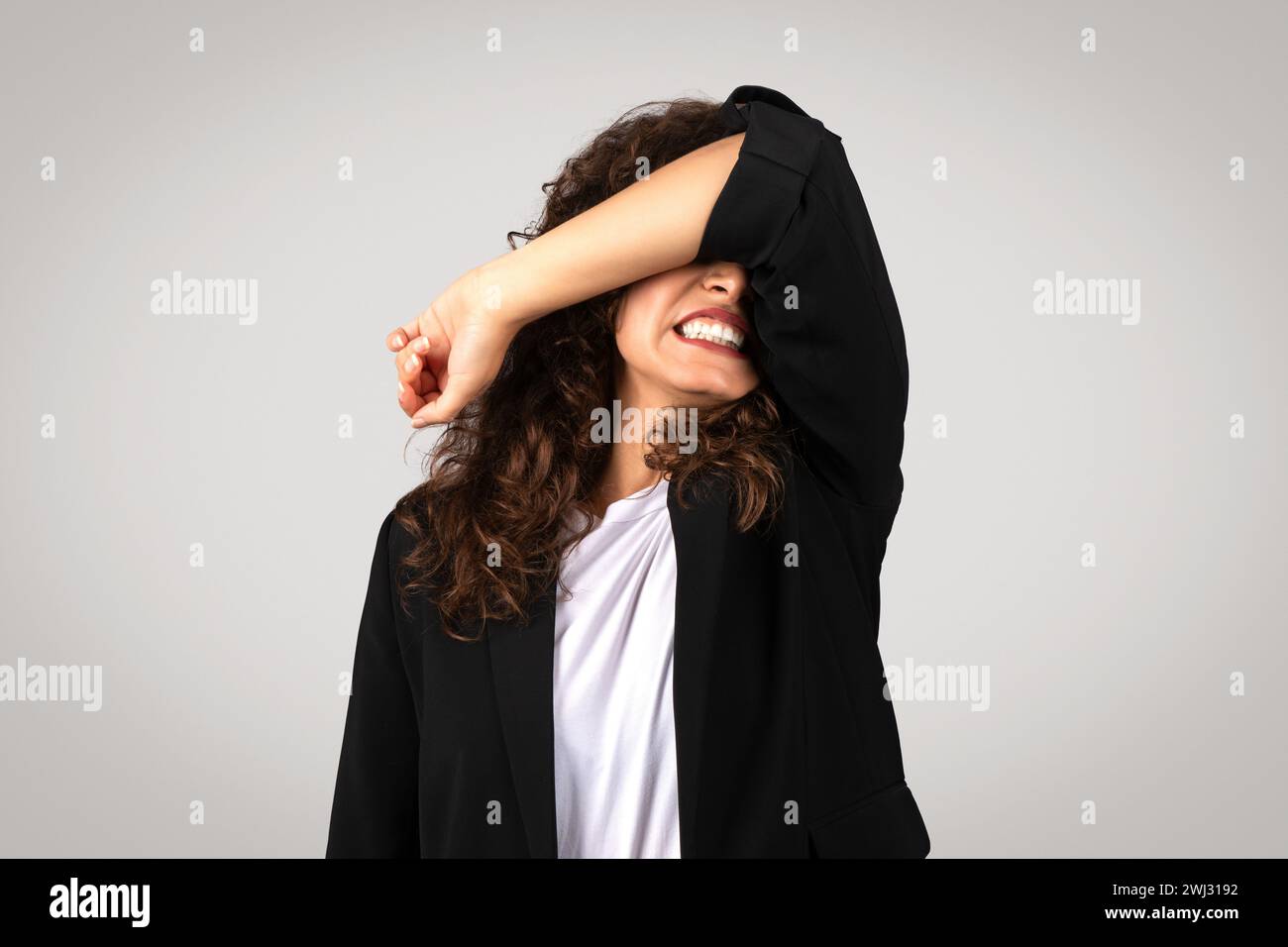Stressed businesswoman with hand on forehead and angry face expression ...