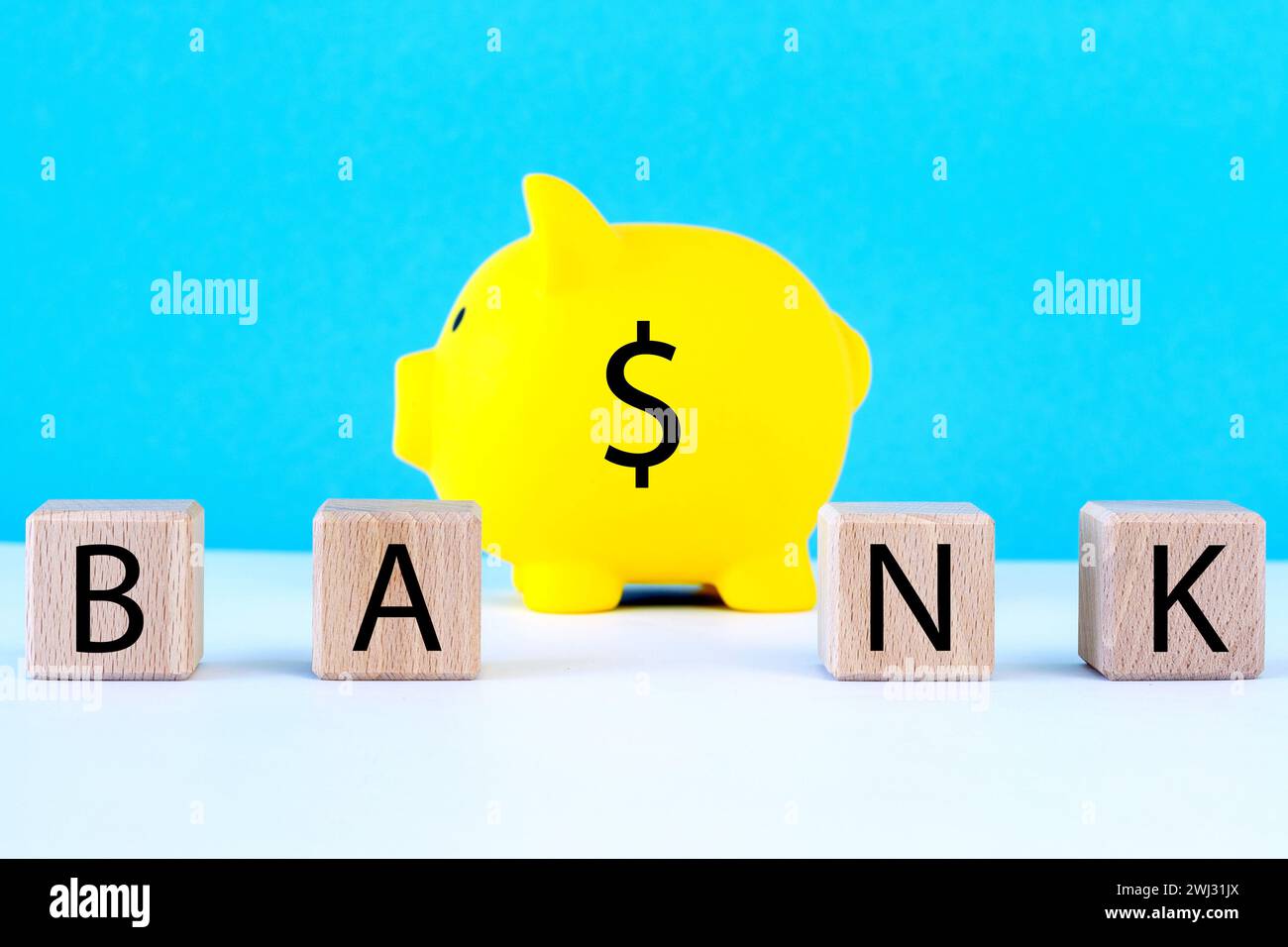 Wooden cubes with word bank, currency . piggy bank. Money saving and ...