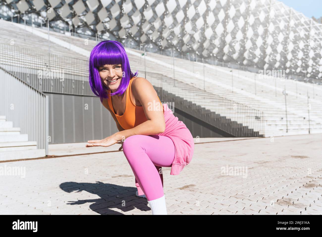 Carefree active woman dancer wearing colorful sportswear having fun on ...