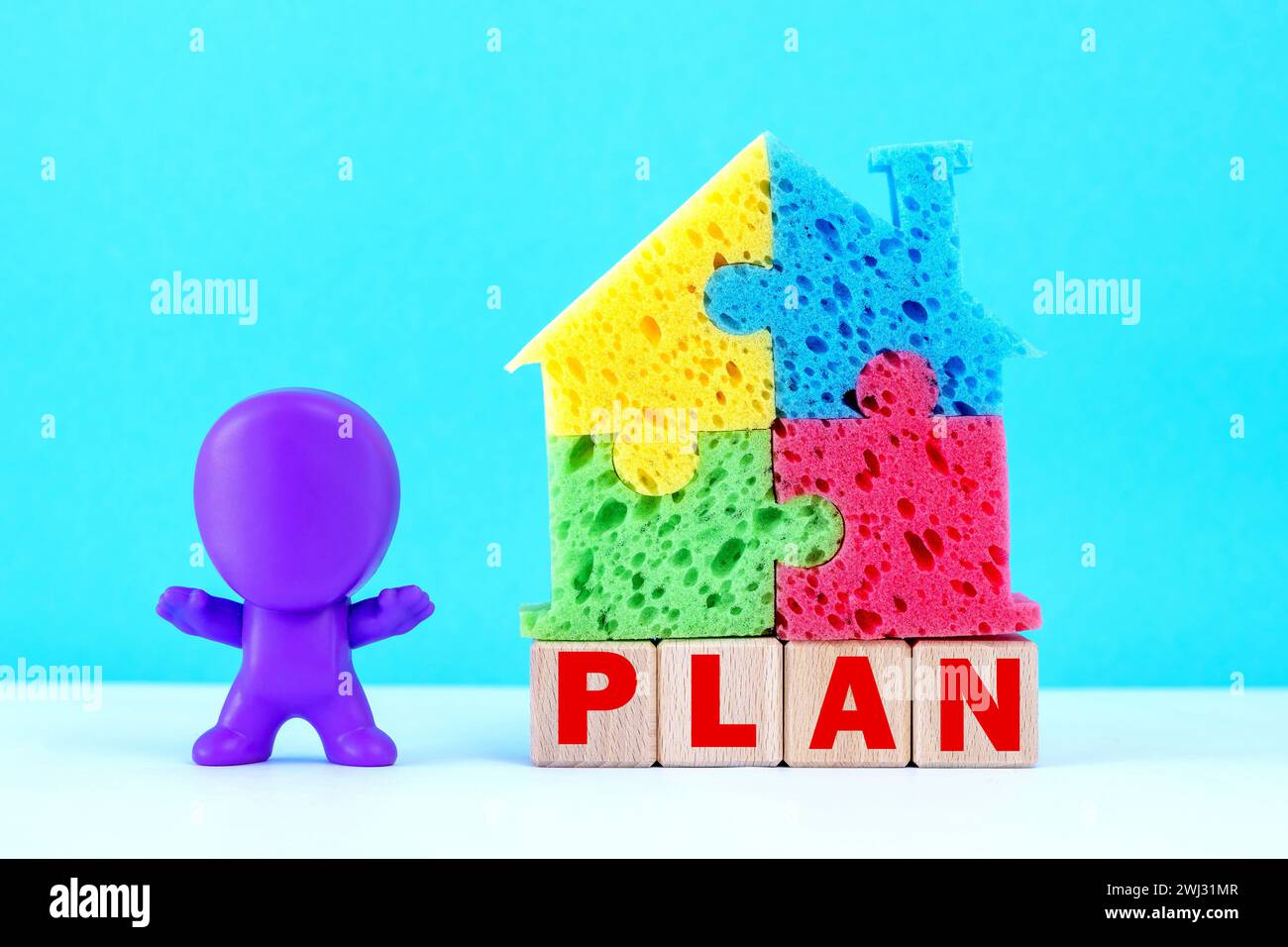 Wooden cubes with word plan.figure of a person. house. house plan ...