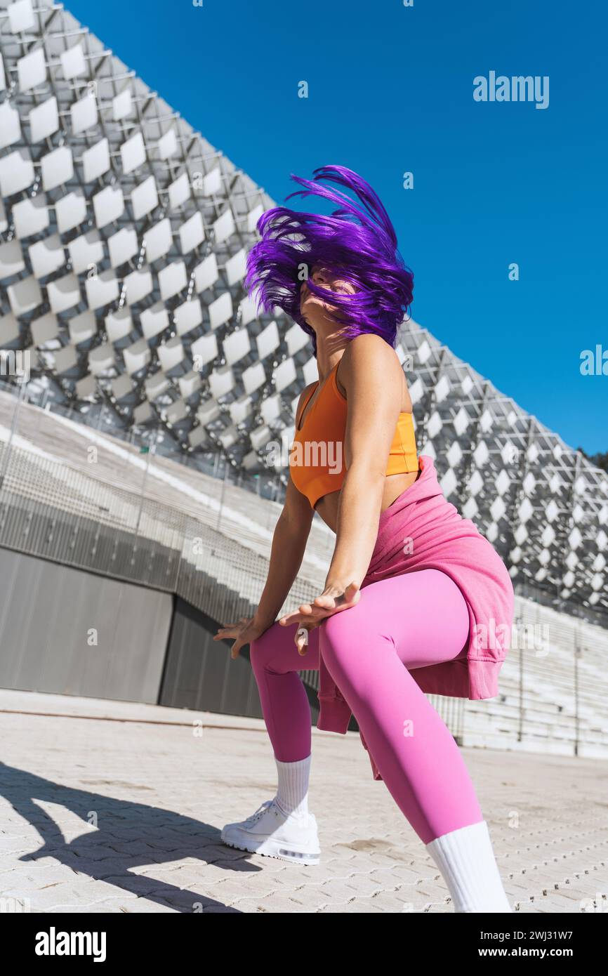 Carefree active woman dancer wearing colorful sportswear having fun on ...
