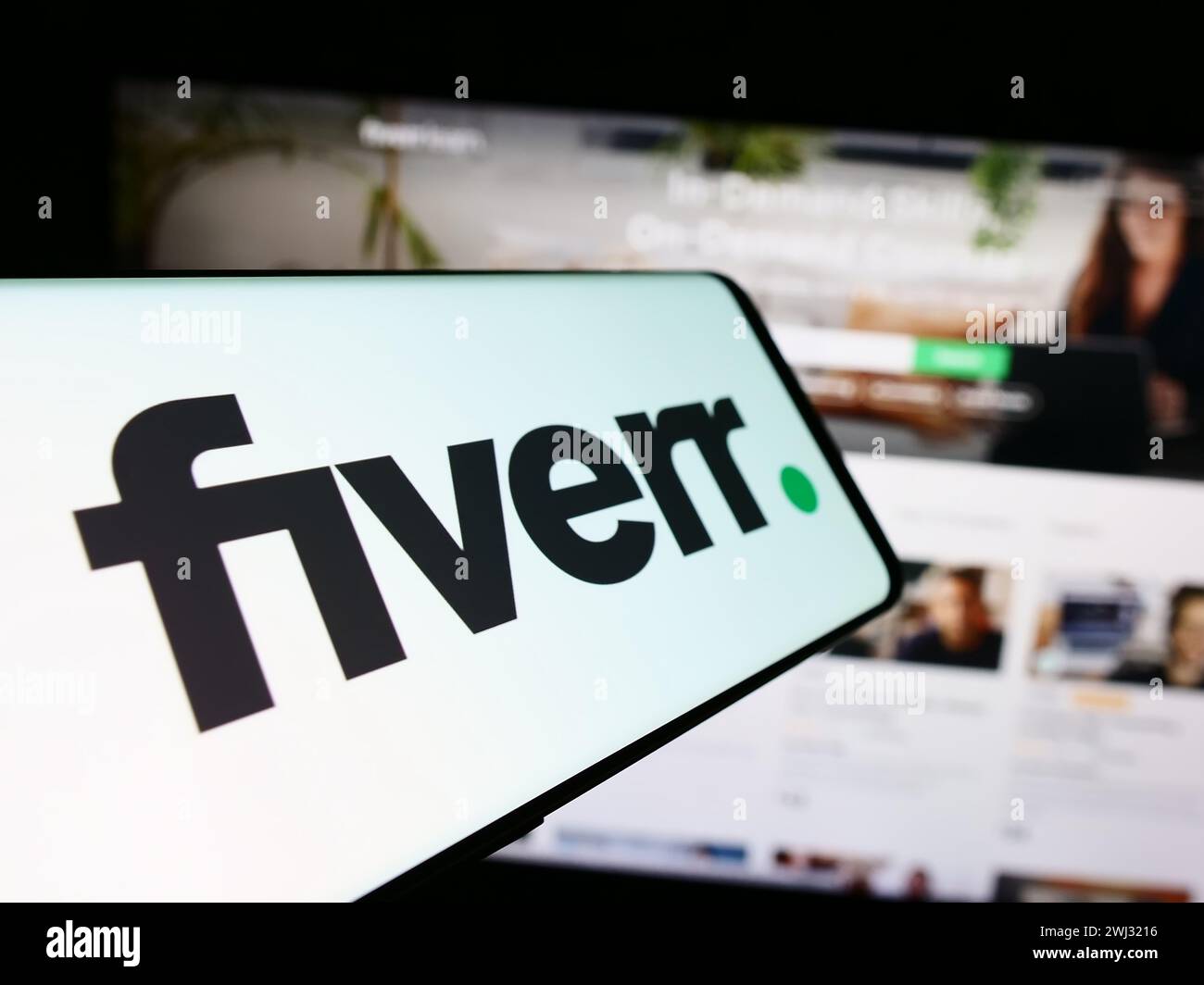 Smartphone with logo of freelance platform company Fiverr International ...