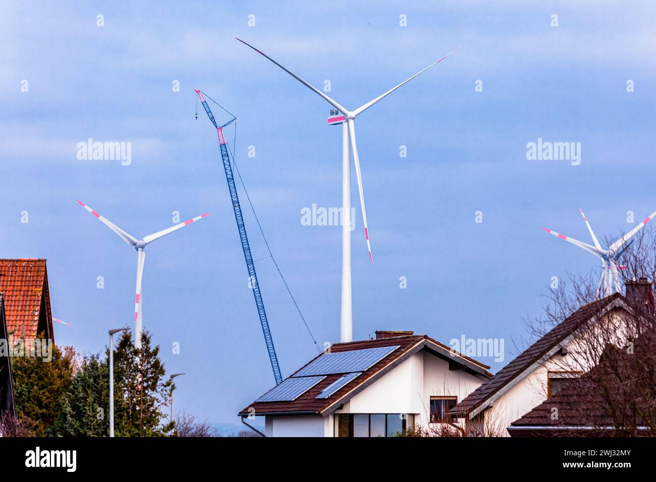 Building and assembling a construction wind turbine by crane near ...