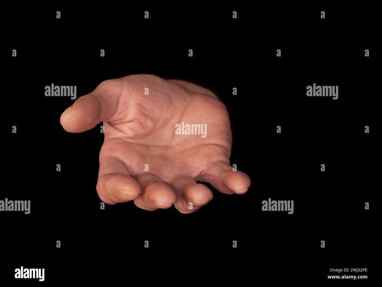 Male hand on a dark background, showing empty asking hand. Praying hand ...