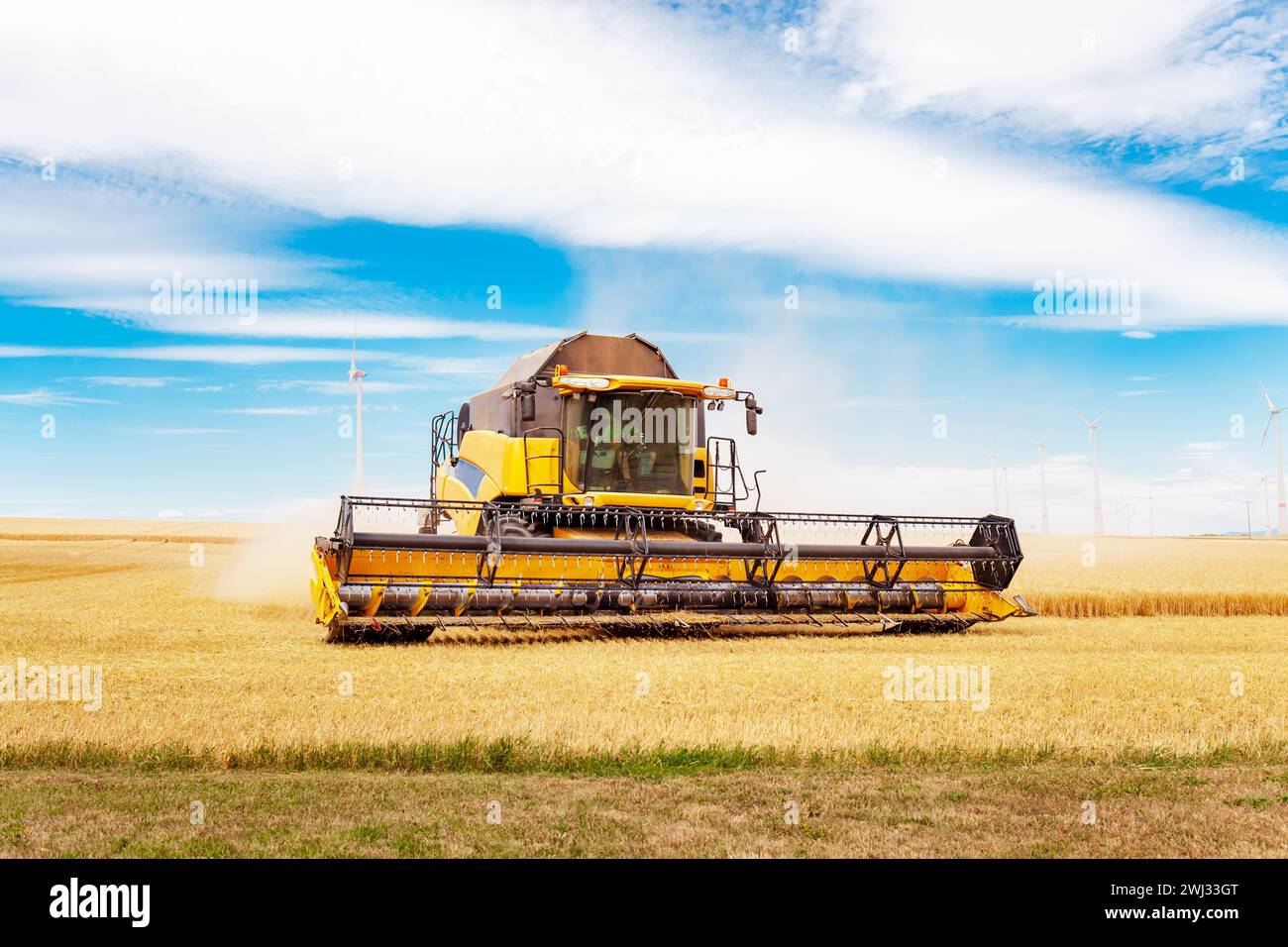 Combine harvester in action on wheat field. Process of gathering a ripe ...