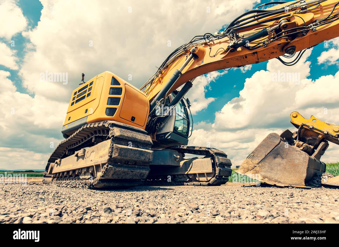 Yellow Excavator at Construction Site. Excavating machinery at the ...