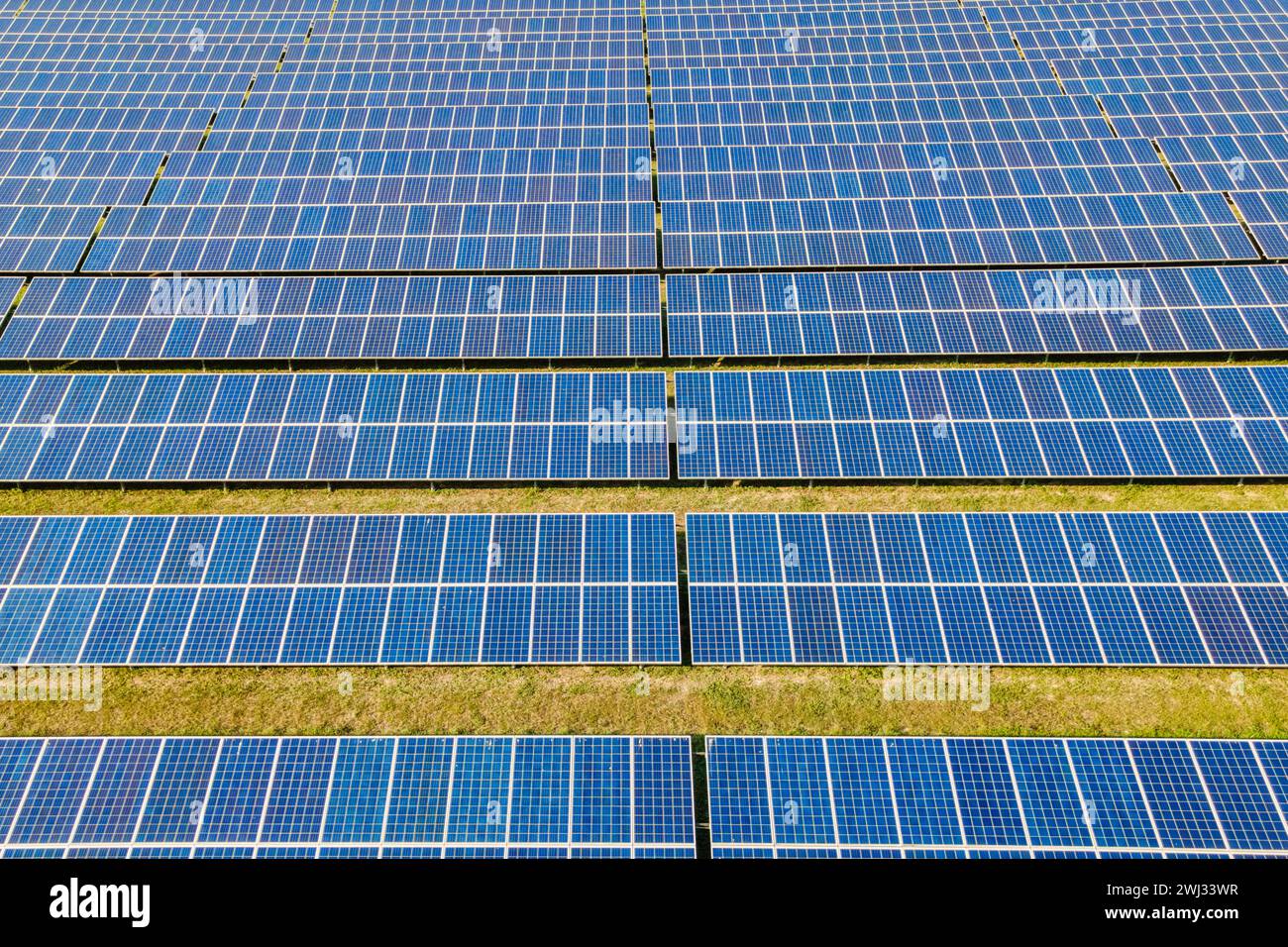 Solar panels sun power on the field in summer aerial view in Thailand ...