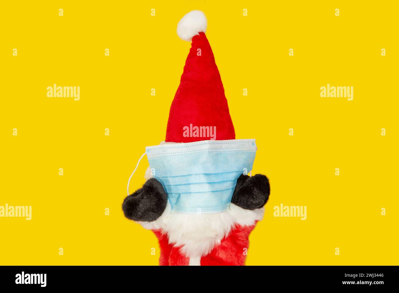 Hand puppet, glove puppet of santa Claus isolated on yellow Background ...
