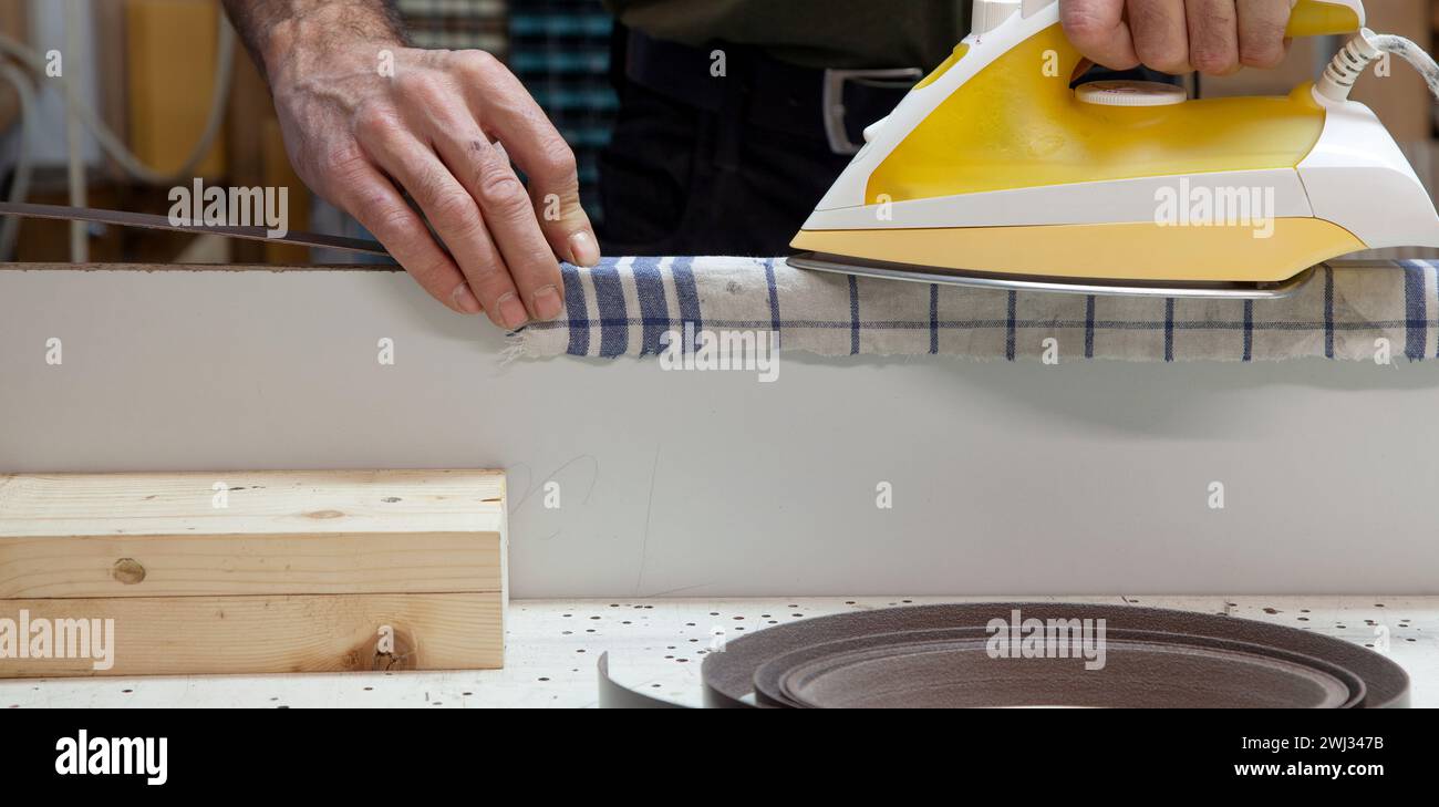 Iron on the wood veneer edge. cabinet wood with Iron-on Edge Banding ...