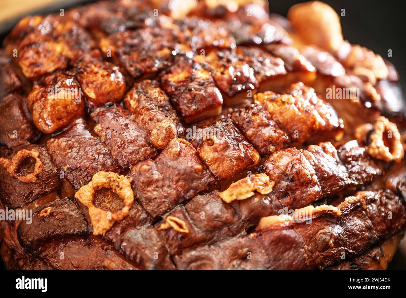 Crispy brown baked fat crust from a roast pork for a festive dinner ...