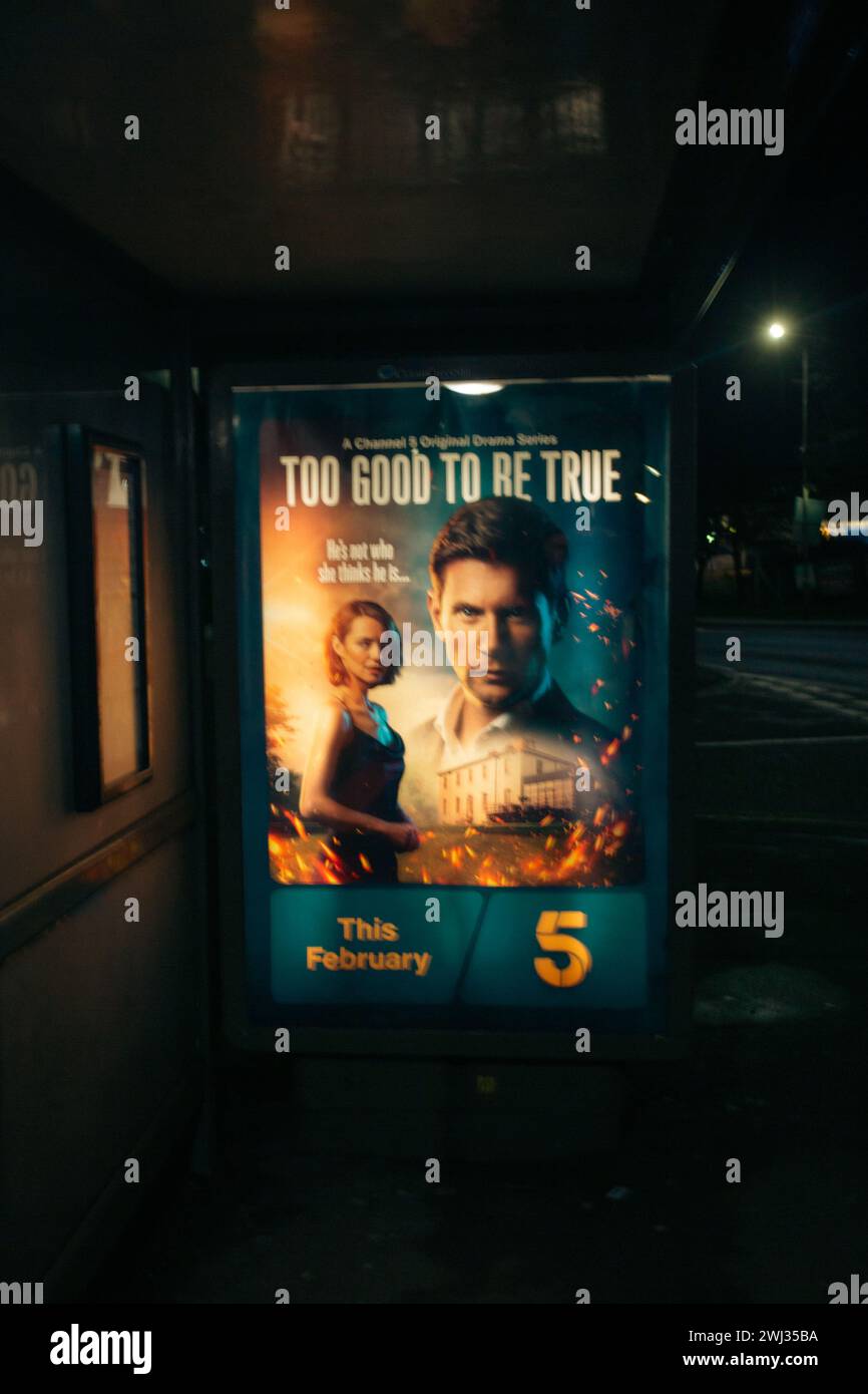 Moody streets at night - Close-up vertical of film advertising ...