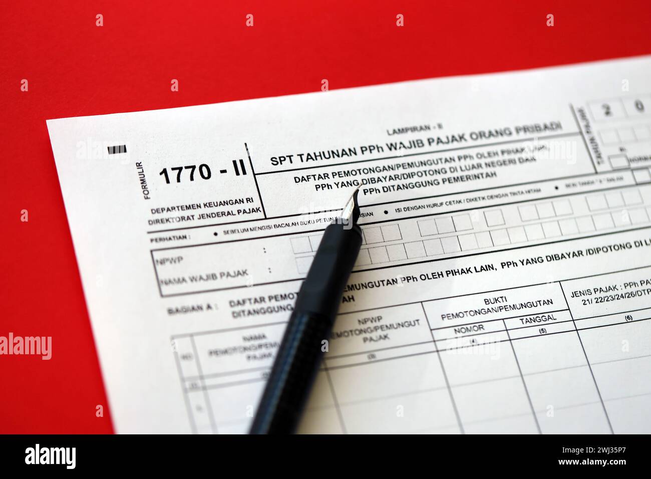 Indonesian tax form 1770-2 Individual Income Tax Return and pen on ...
