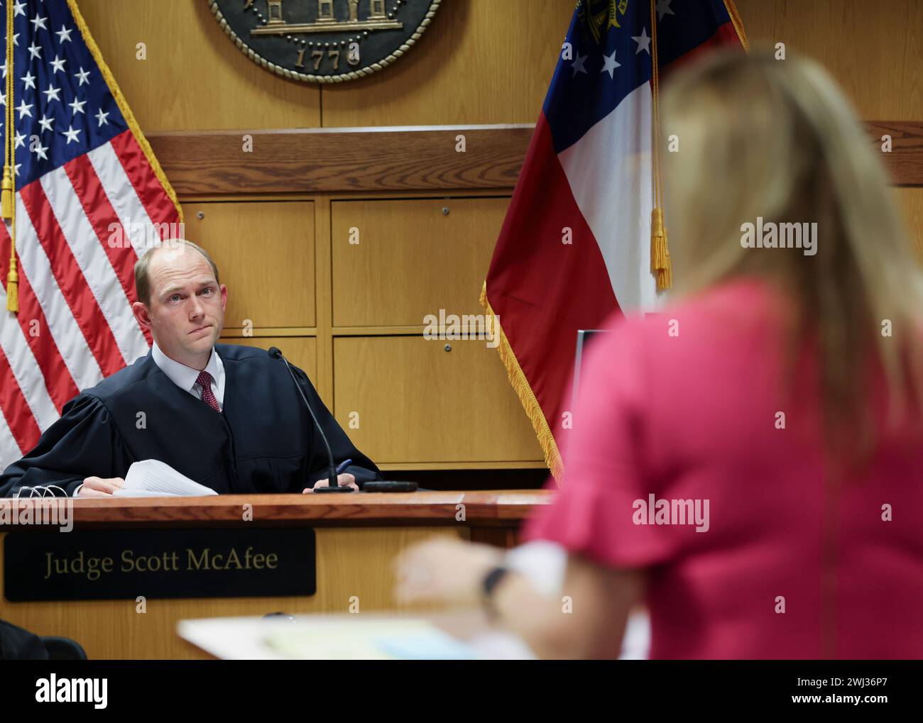 Ashleigh Merchant, attorney for Michael Roman, sits in front of Fulton ...