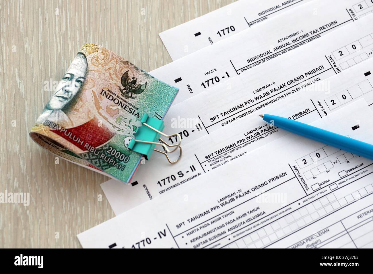 Annual Individual Income Tax Return forms with pen and indonesian ...