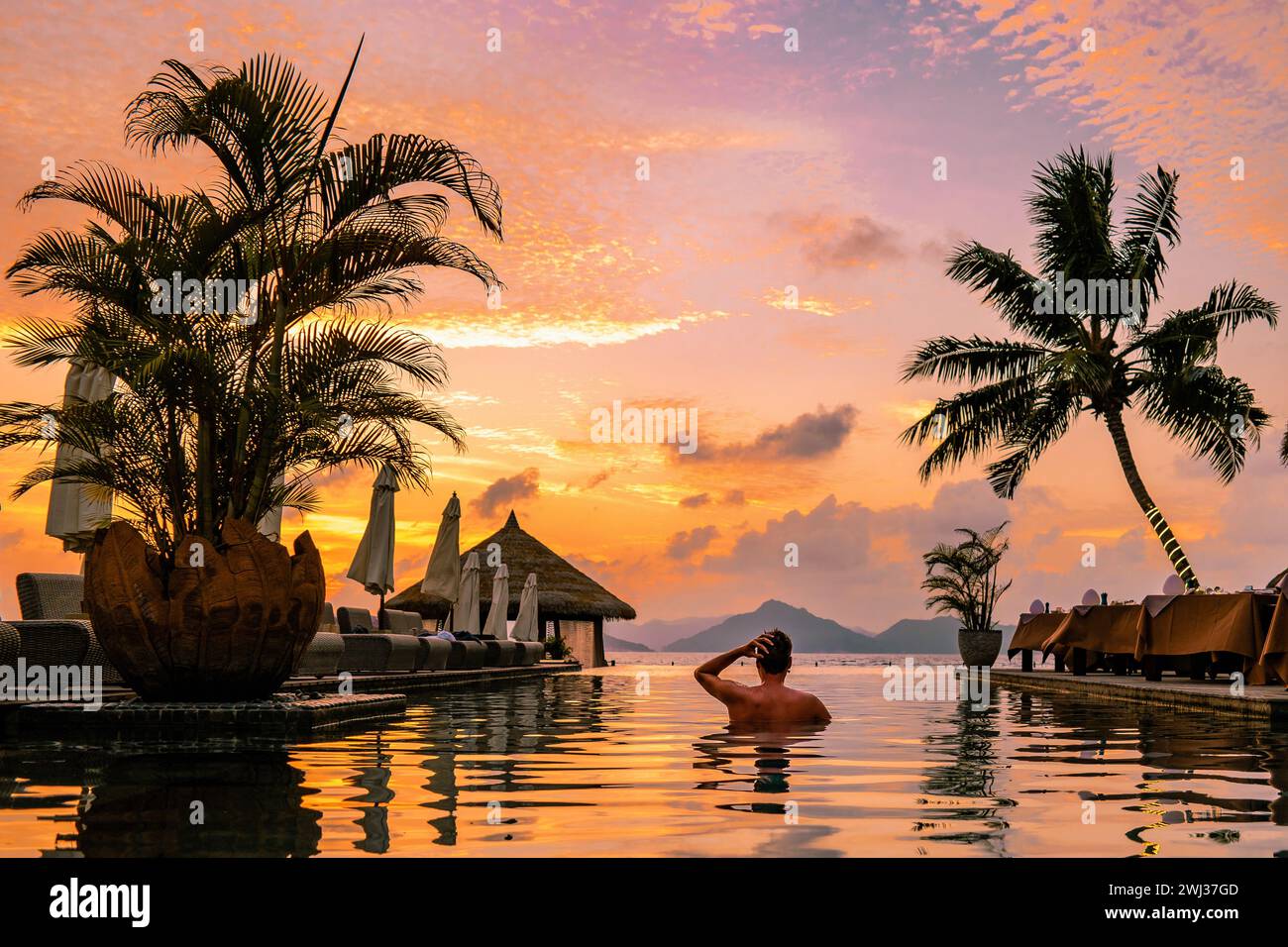 Luxury swimming pool in tropical resort, relaxing holidays in ...