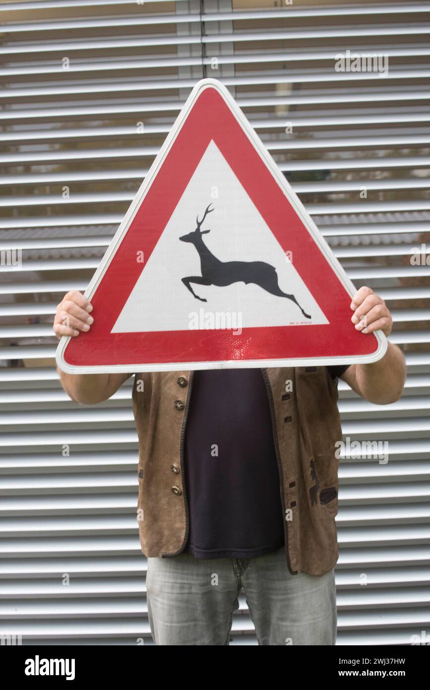 Attention animal crossing traffic or road sign Stock Photo - Alamy