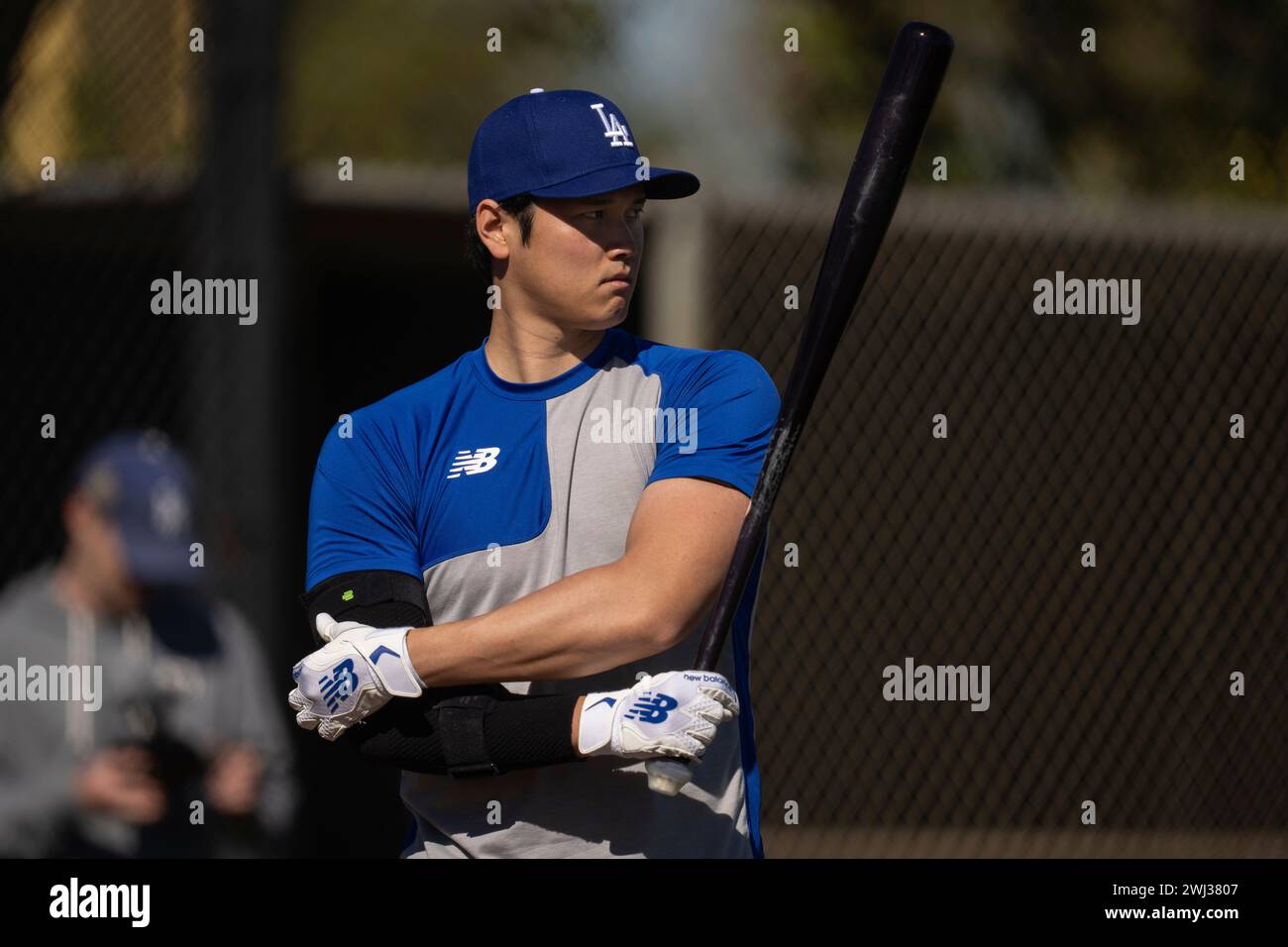 Los Angeles Dodgers' Shohei Ohtani walks across the field to batting ...