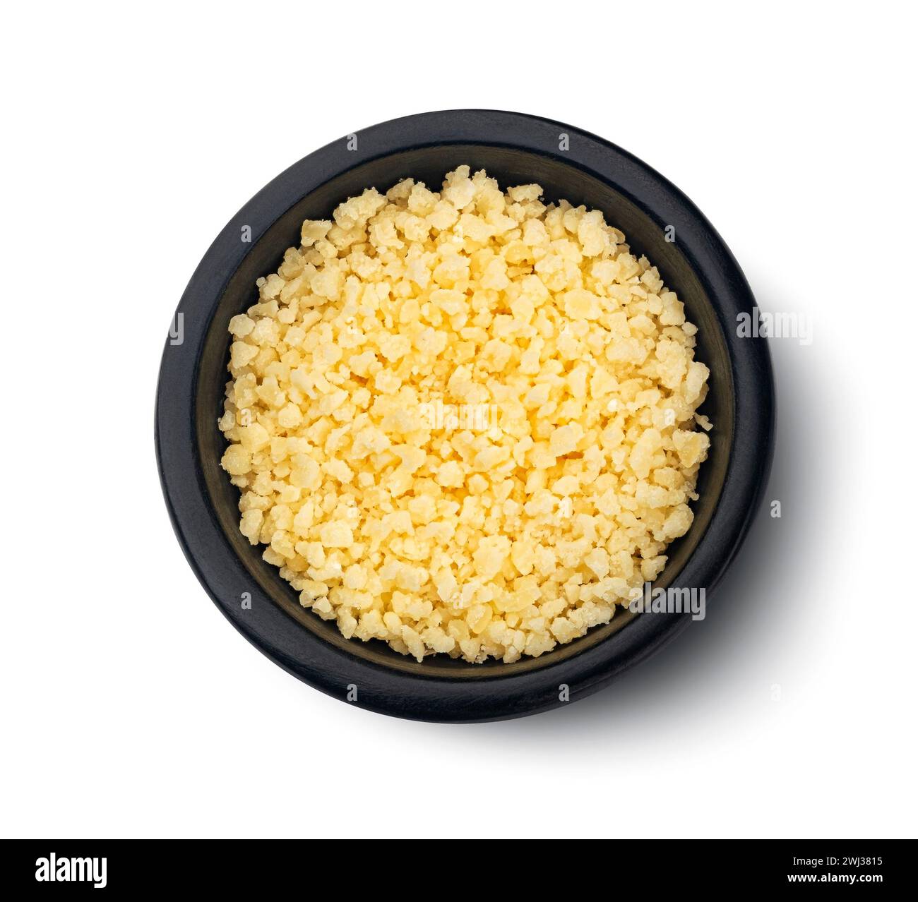 Grated parmesan cheese in black bowl isolated on white background, top ...