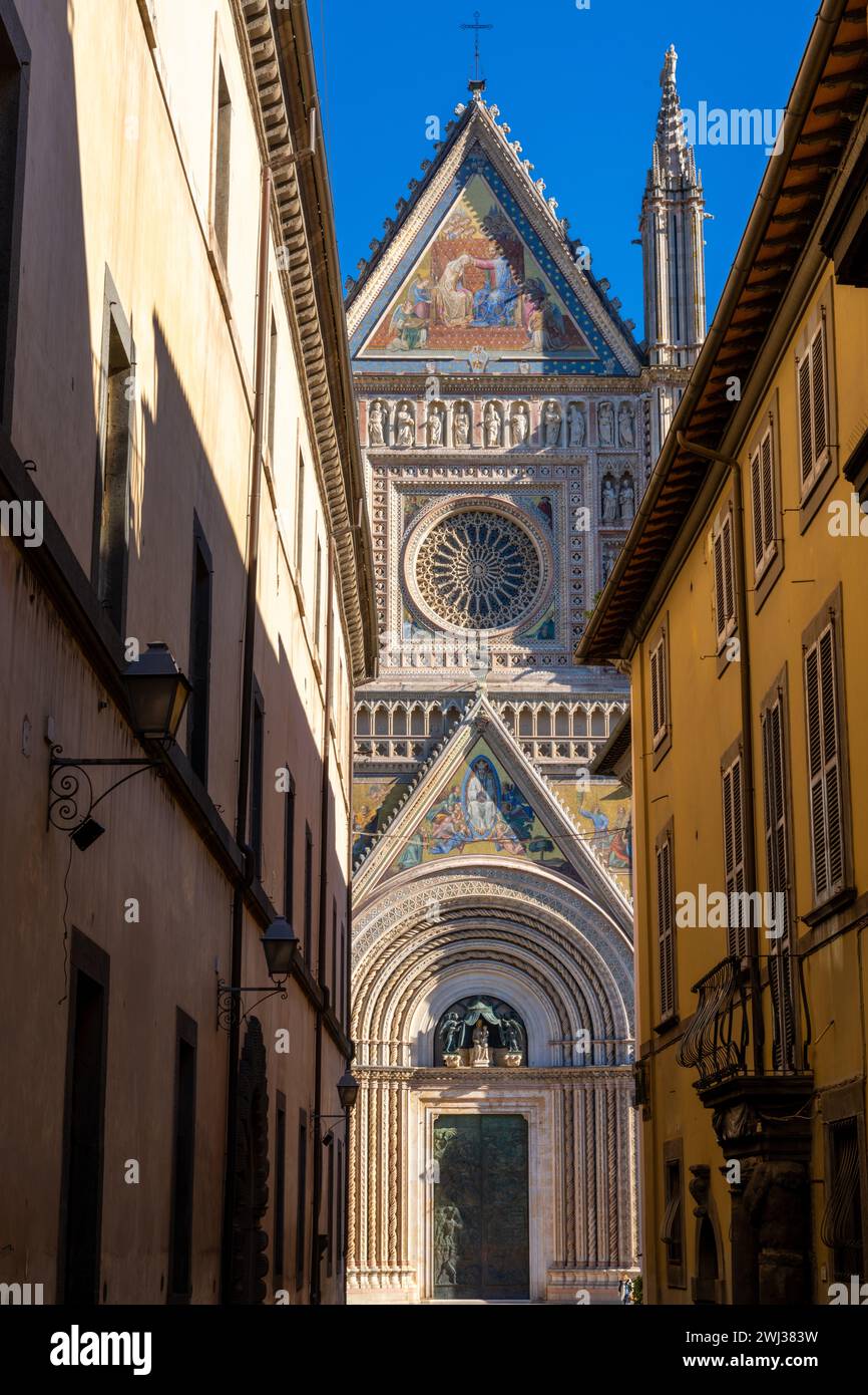 Vertical view of narrow Orvieto Streets with the spire of the Orvieto ...