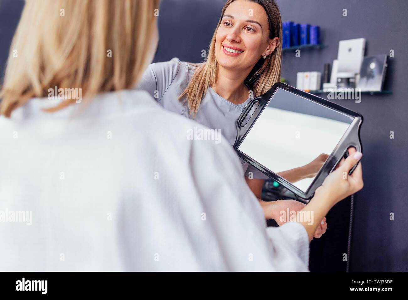 Doctor checking woman face skin in cosmetology clinic before plastic ...