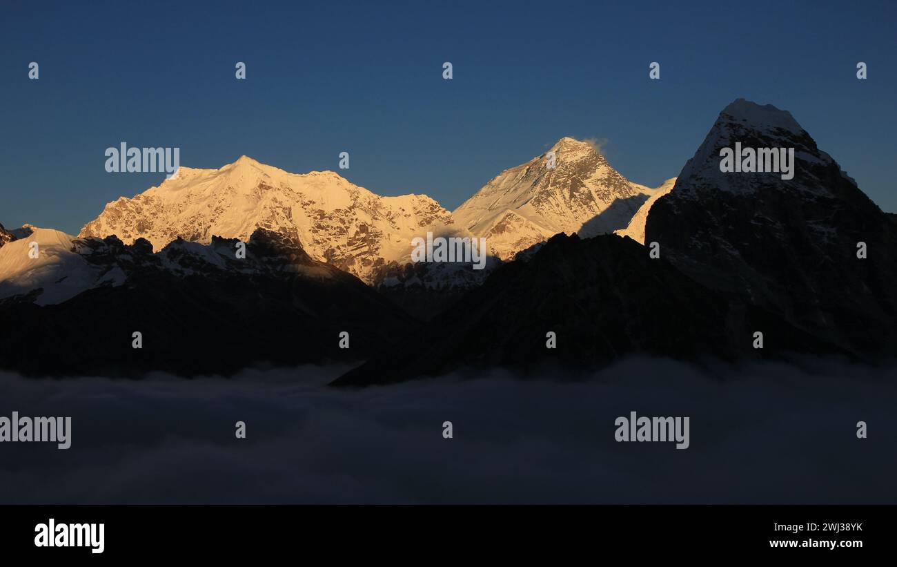 Snow covered Chumbu and Mount Everest just before sunset Stock Photo ...