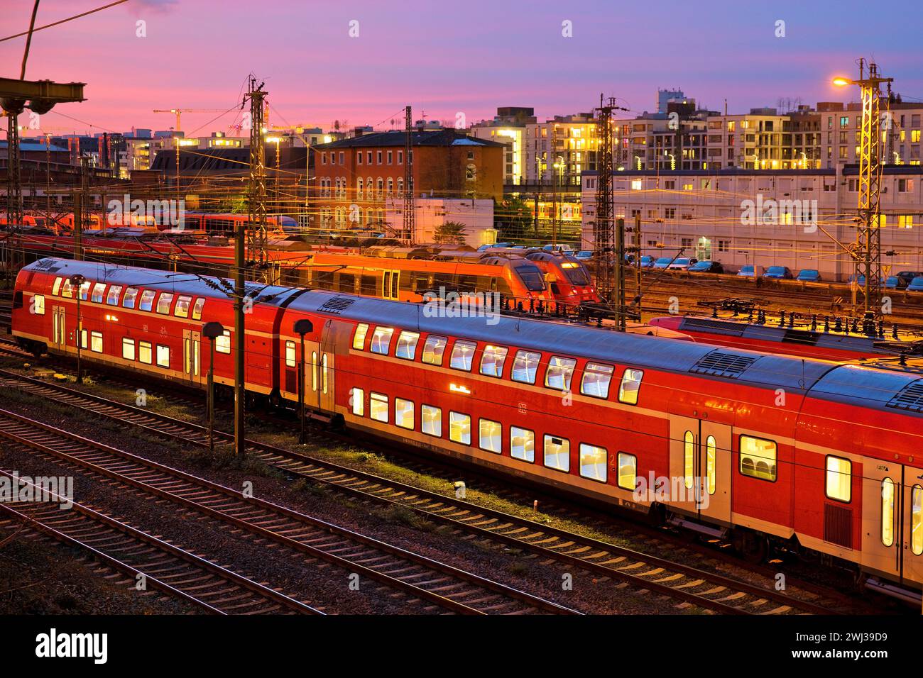 Elevated view of a double-decker local train at sunset, Frankfurt am ...